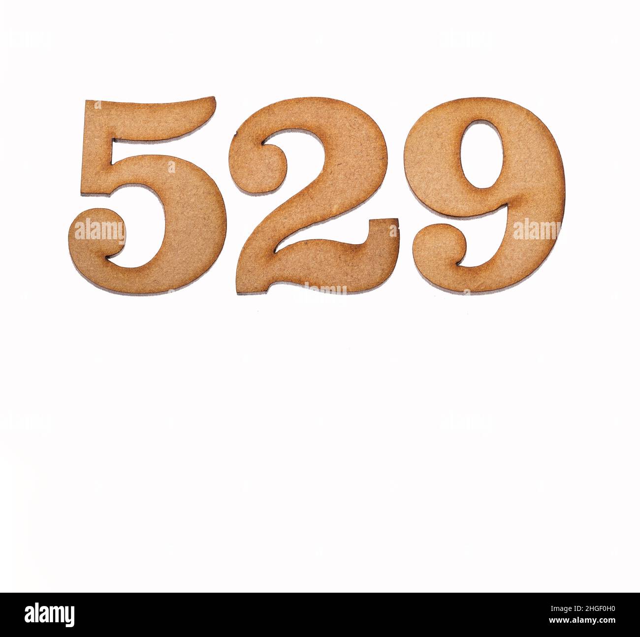 Number 529 in wood, isolated on white background Stock Photo - Alamy