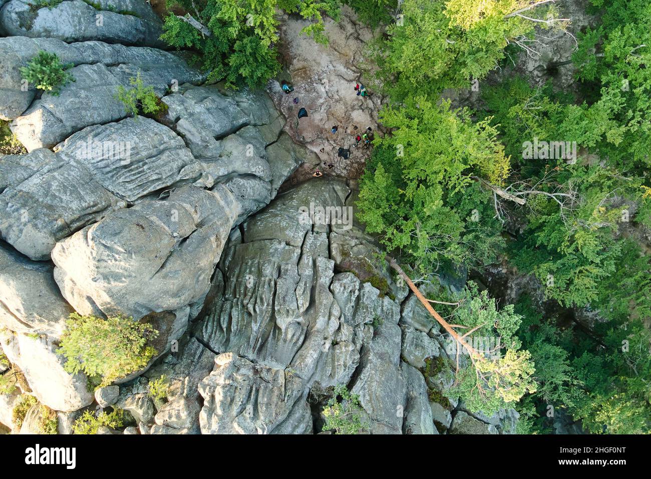 Aerial view of bright landscape with green forest trees and big rocky ...