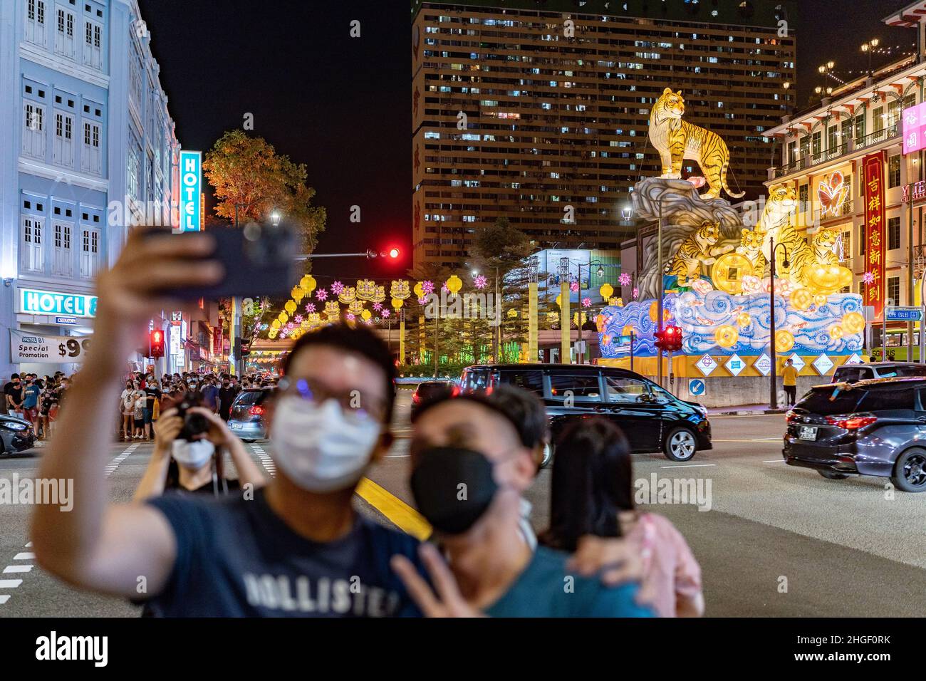 People wearing protective face masks as a preventive measure against ...