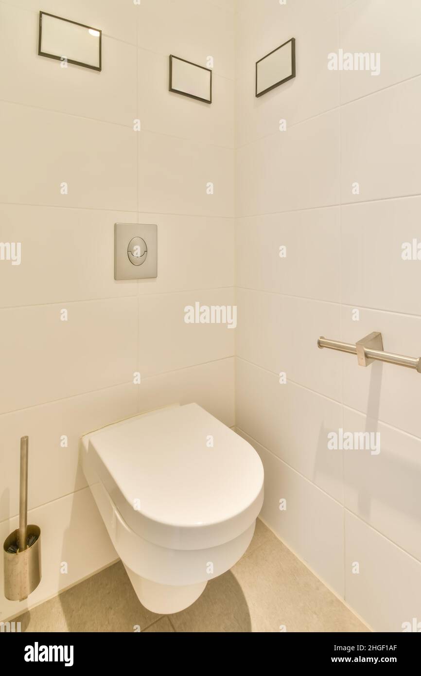 Interior of small clean restroom in miniature style Stock Photo - Alamy