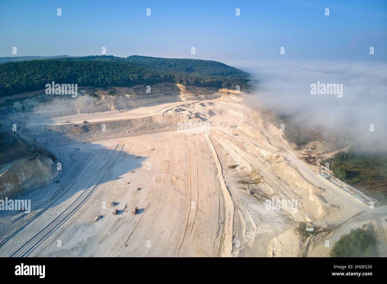 Aerial view of open pit mining of limestone materials for construction ...