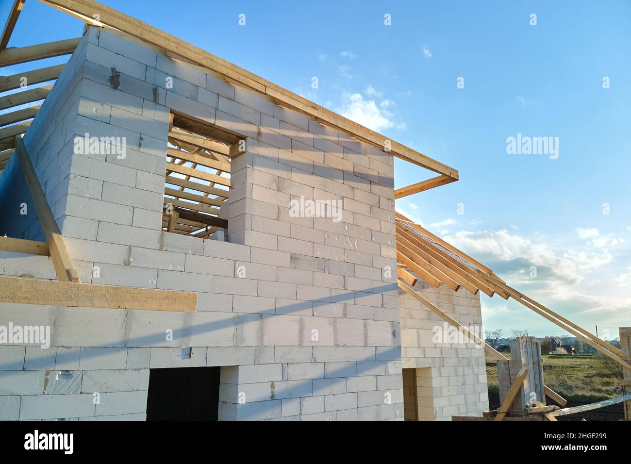 Aerial view of unfinished frame of private house with aerated ...