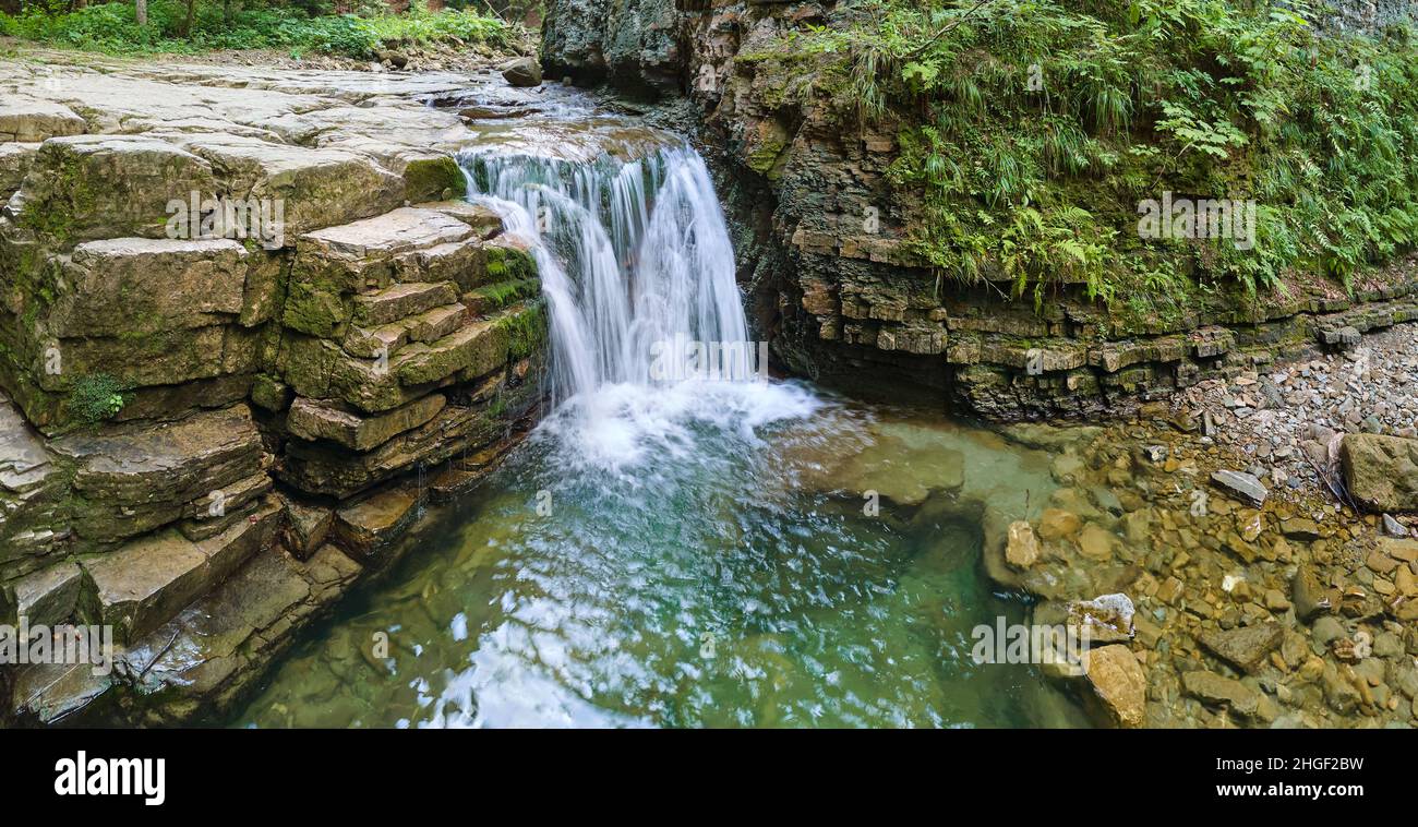 Amazing landscape of beautiful waterfall on mountain river with white ...