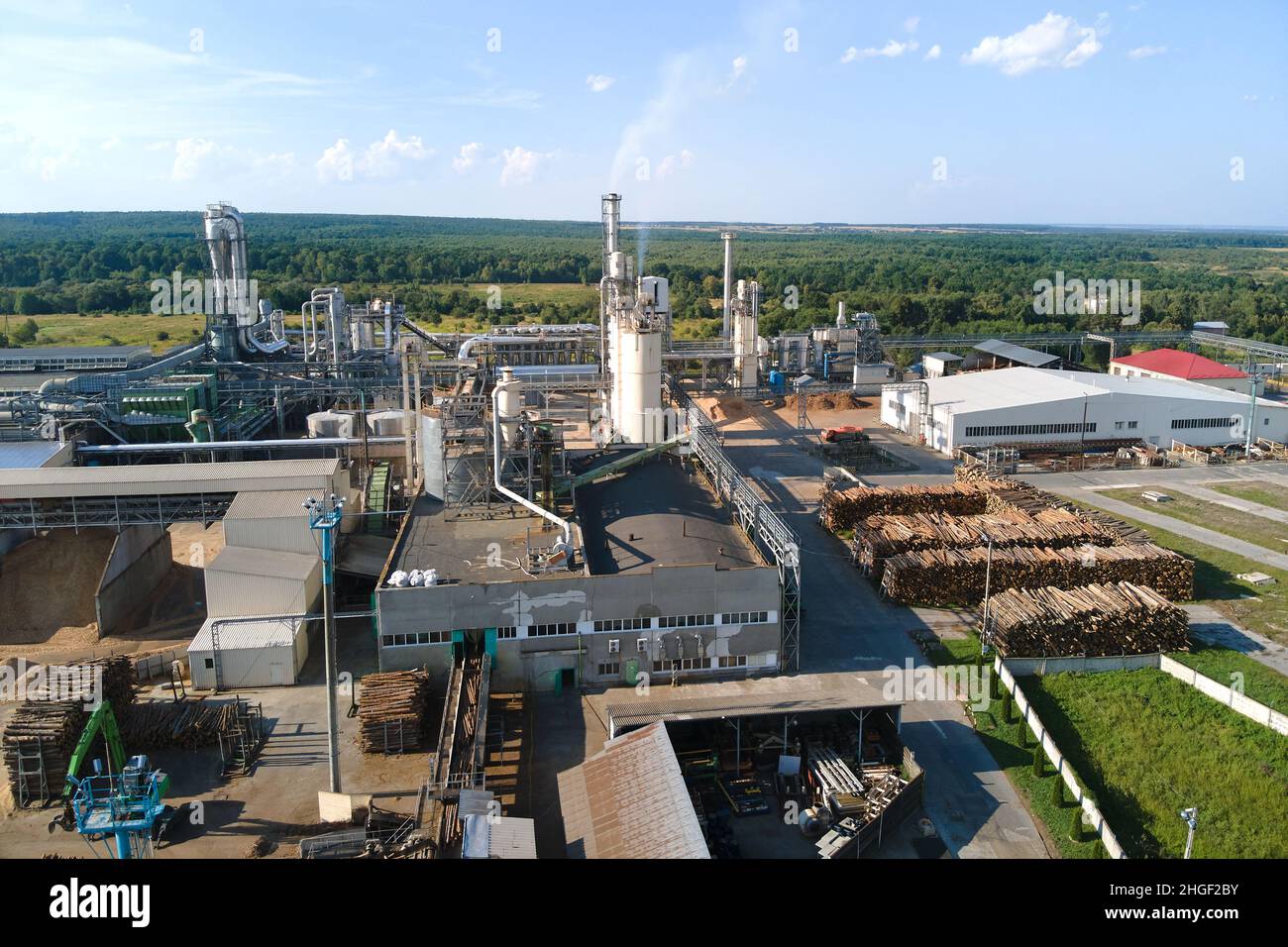 Aerial view of wood processing factory with stacks of lumber at plant ...