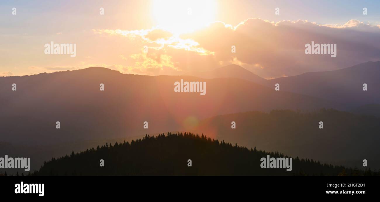 Beautiful evening panoramic landscape with bright setting sun over ...