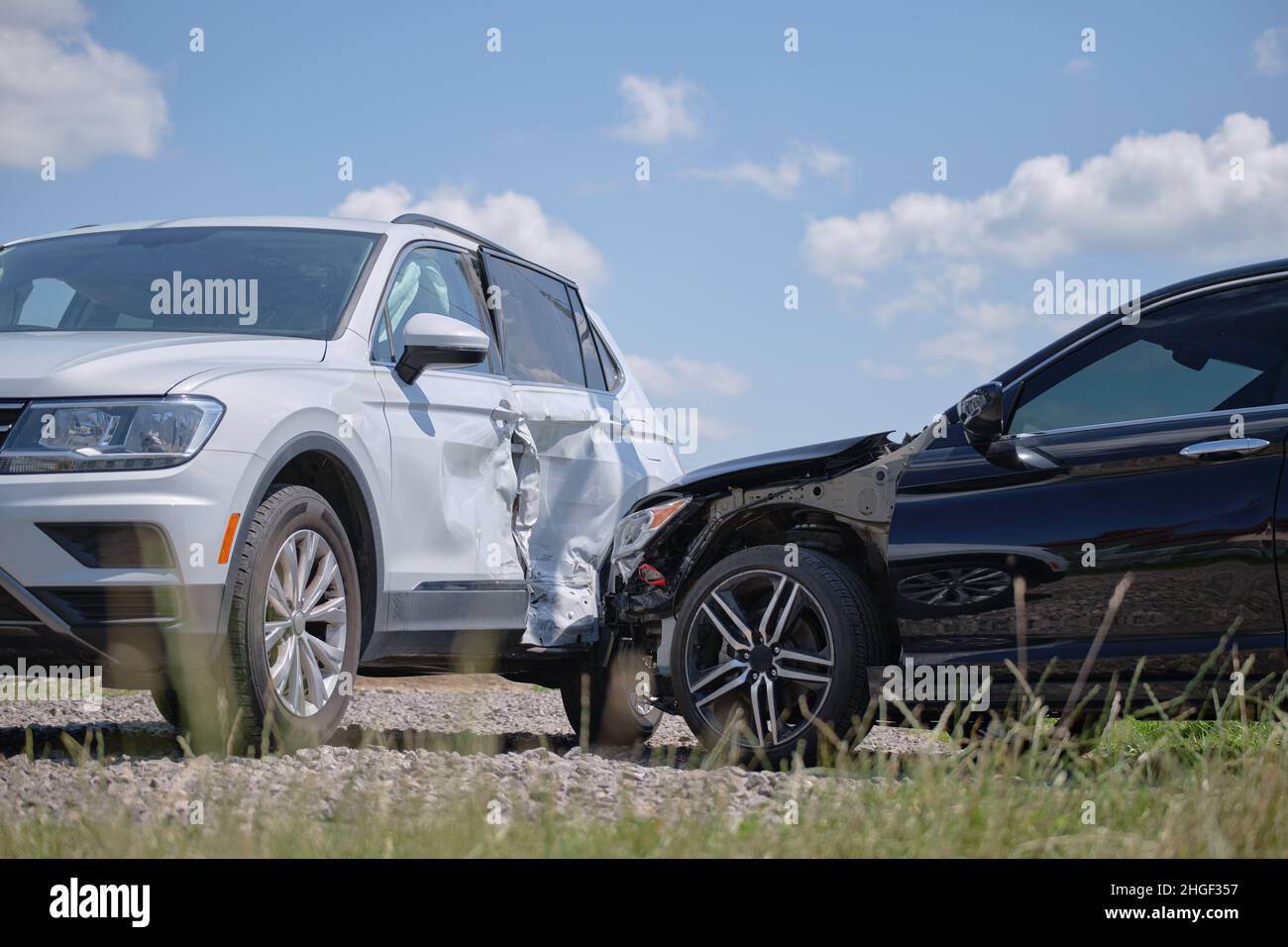 Damaged in heavy car accident vehicles after collision on city street ...