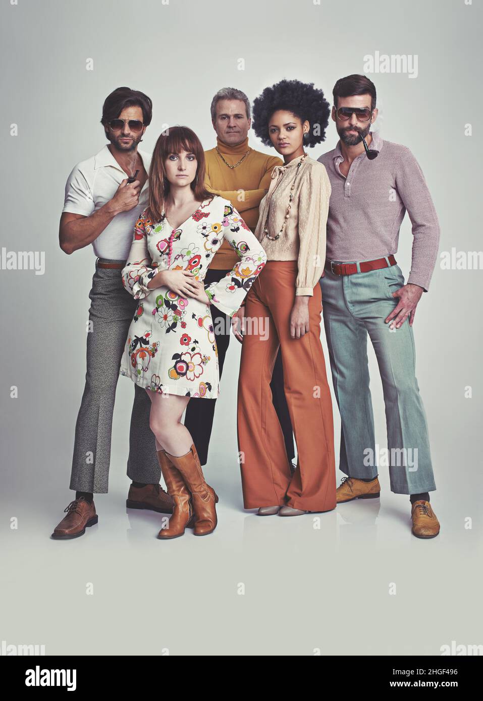 Nothing like some 70s style. A studio shot of a group of people ...