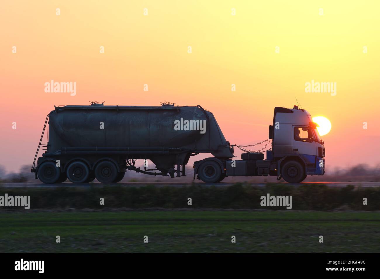 Petrol cargo truck driving on highway hauling oil products. Delivery ...