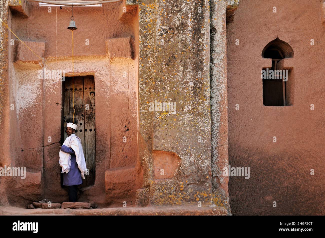 Orthodox priest at the door of Bet Gabriel-Rufael, Lalibela, Amhara ...