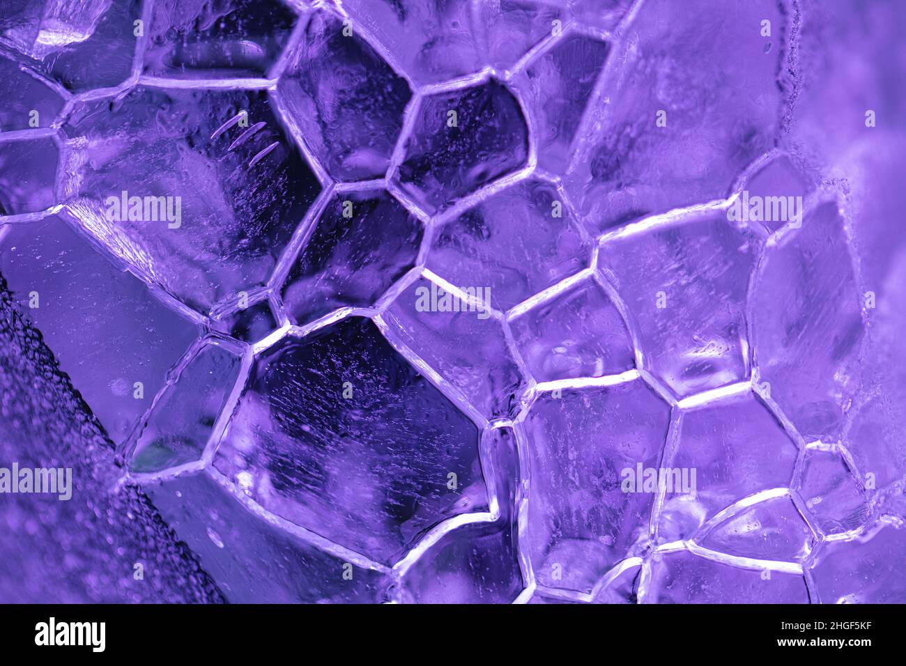 closeup of ice with colourful backlight for design purpose, textured ...
