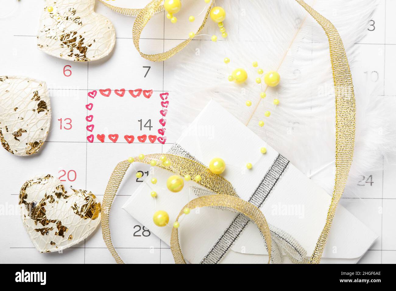 Calendar with marked date of Valentine's Day and decor, closeup Stock ...