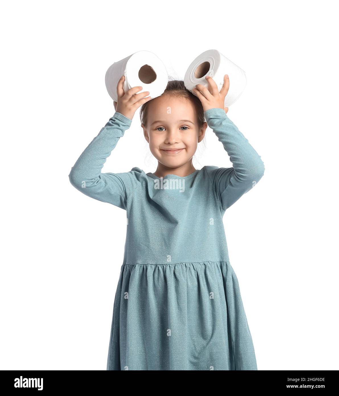 Funny little girl with rolls of toilet paper on white background Stock ...
