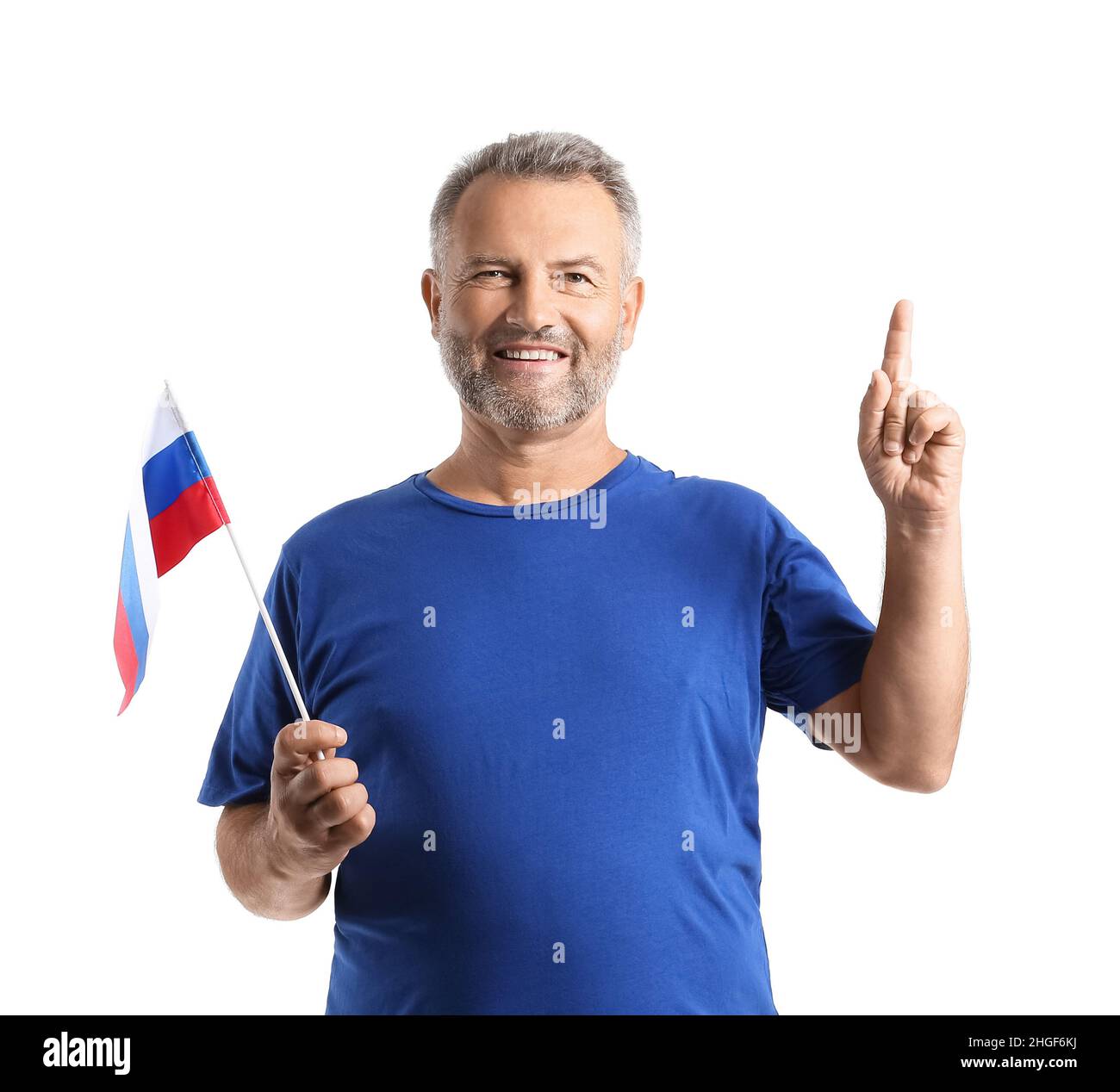 Handsome mature man with flag of Russia pointing at something on white ...