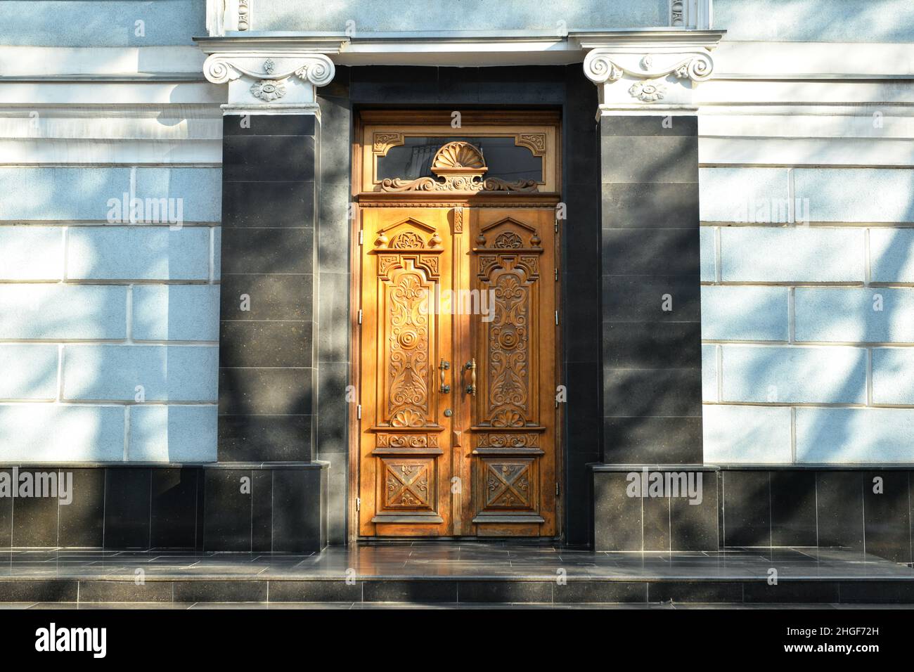 Closed doors of beautiful old building on city street Stock Photo - Alamy