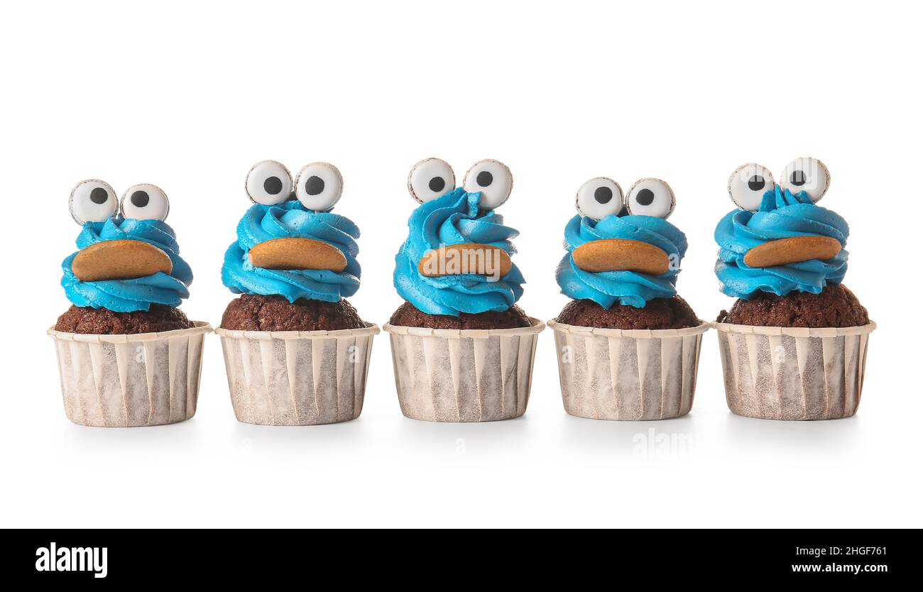 Tasty funny cupcakes for Halloween celebration on white background ...