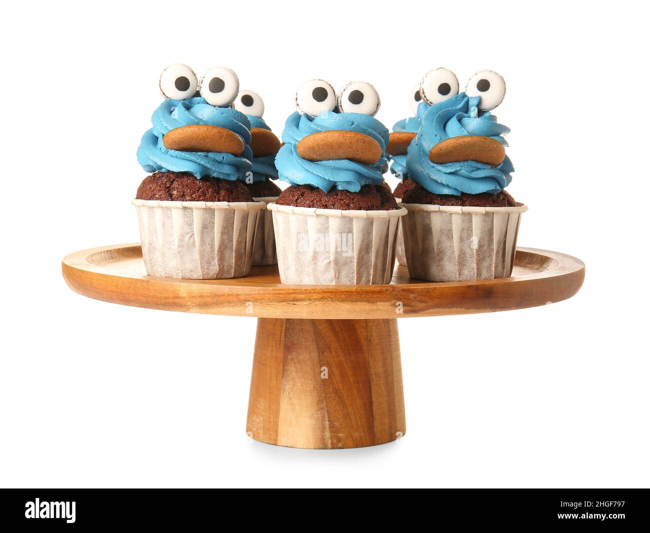 Stand with tasty funny cupcakes for Halloween celebration on white ...