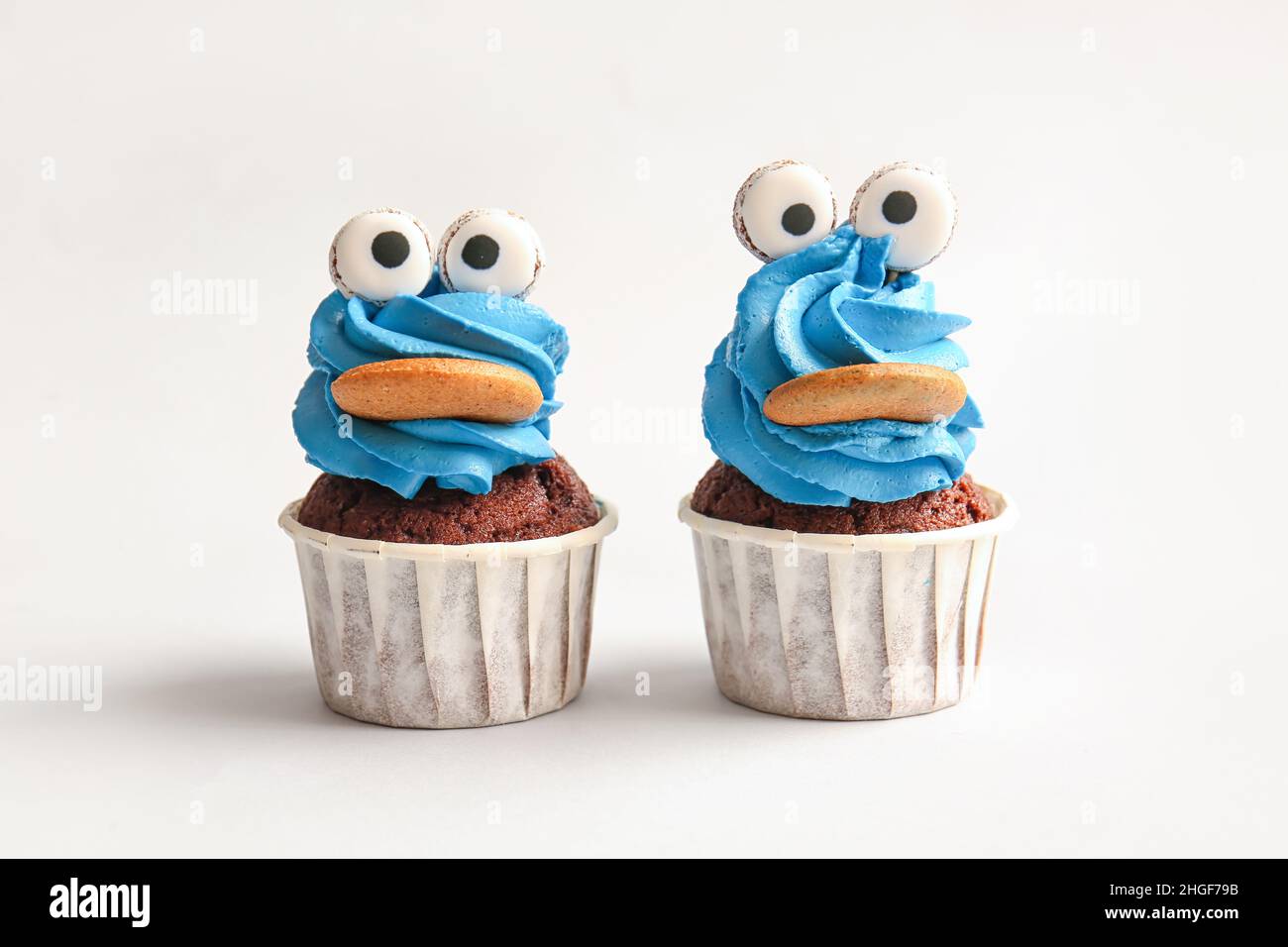 Tasty funny cupcakes for Halloween celebration on white background ...