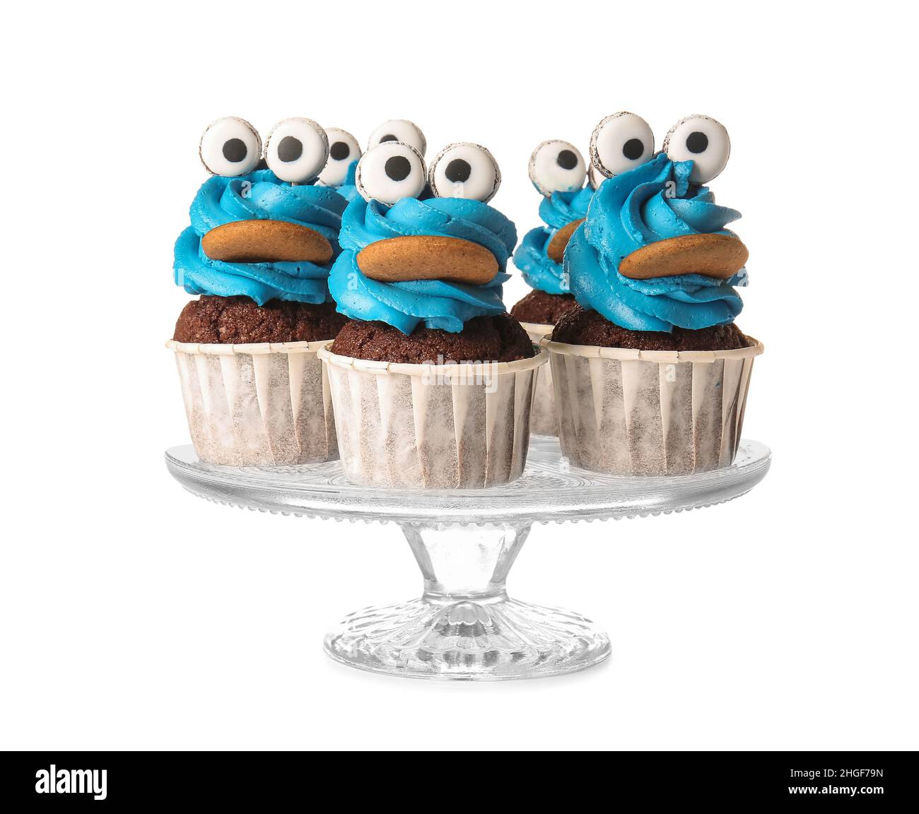 Stand with tasty funny cupcakes for Halloween celebration on white ...
