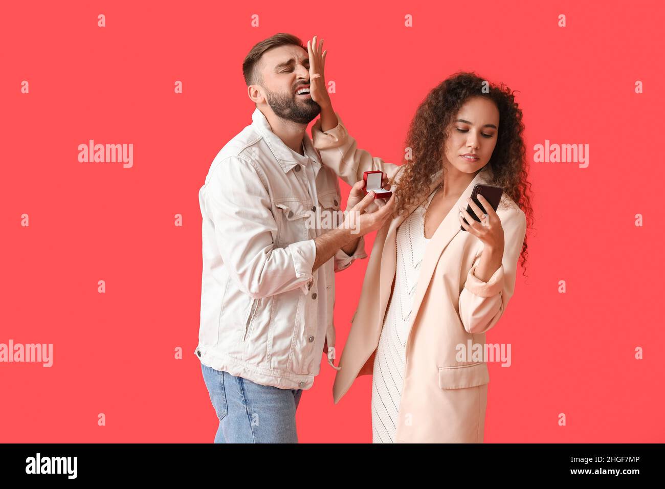 Young African-American woman rejecting marriage proposal on color ...