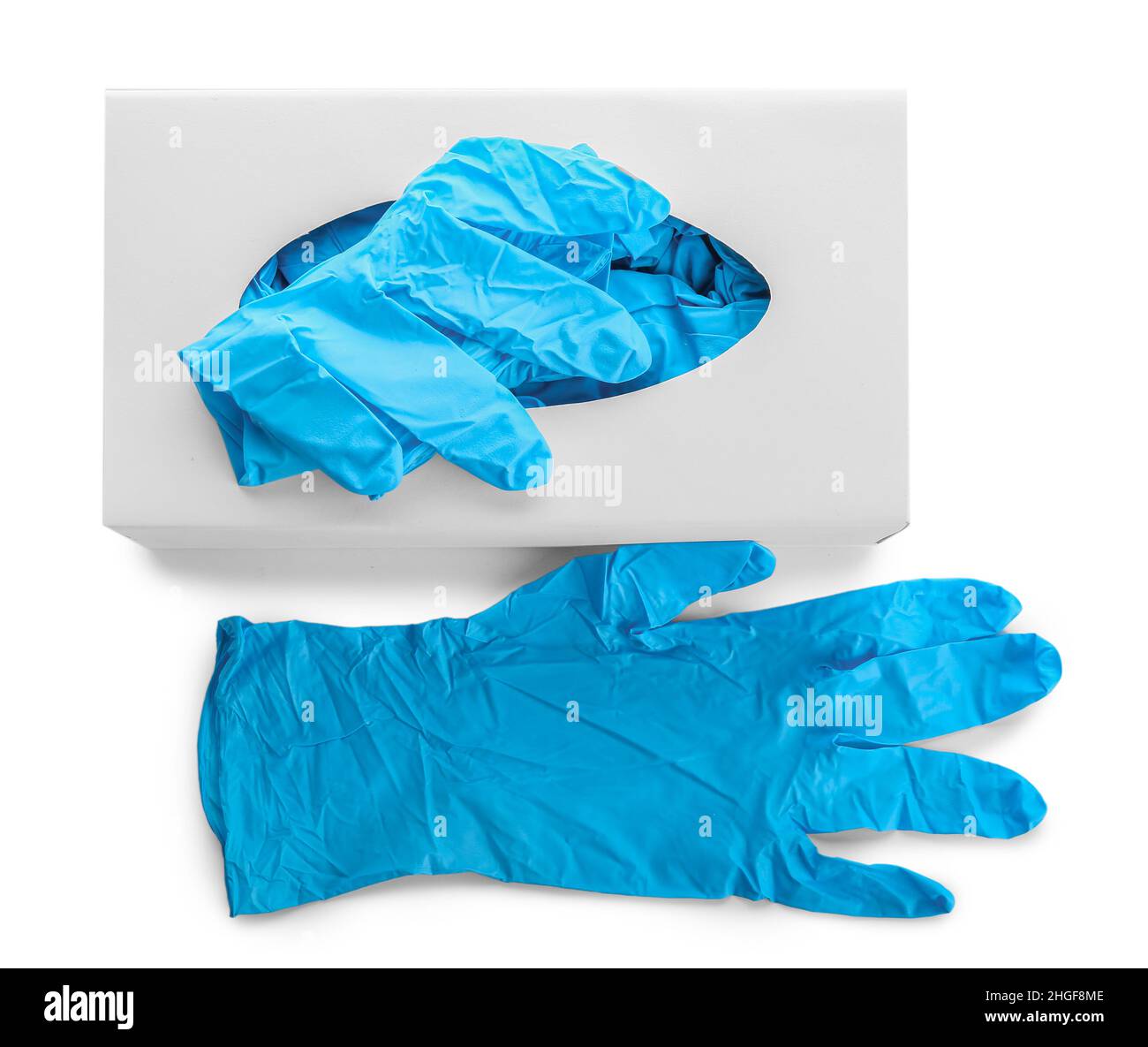 Paper box with blue medical gloves on white background Stock Photo - Alamy