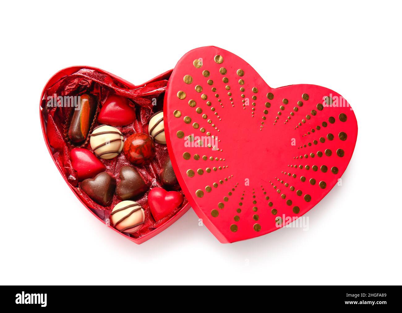 Heart shaped box with tasty chocolate candies isolated on white ...