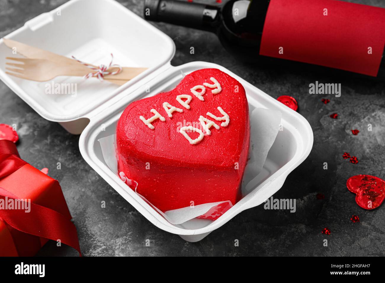 Plastic lunch box with tasty bento cake on grey background, closeup ...