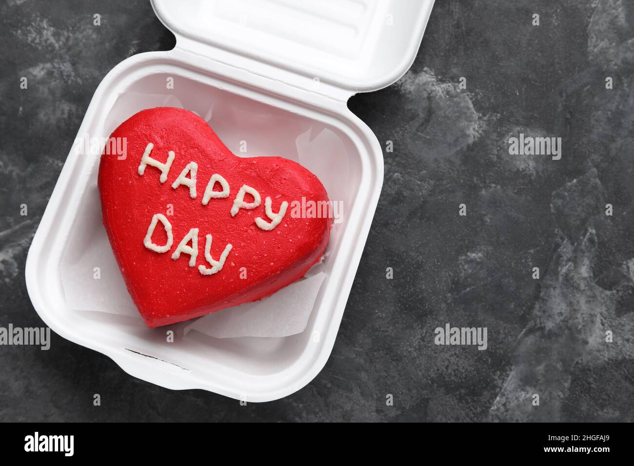 Plastic lunch box with tasty bento cake on grey background Stock Photo ...