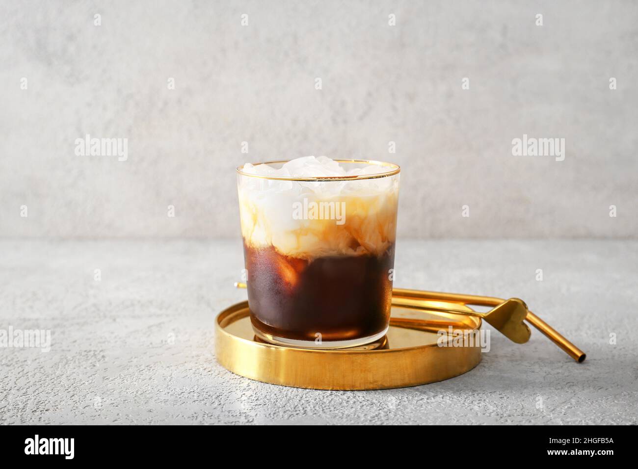 Glass of White Russian cocktail on light background Stock Photo - Alamy