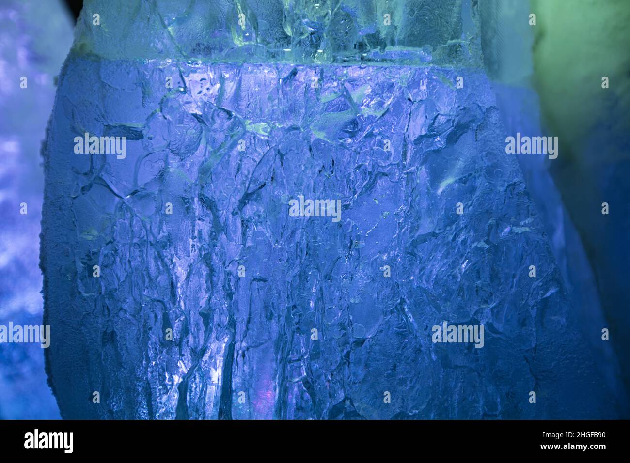 closeup of ice with colourful backlight for design purpose, textured ...