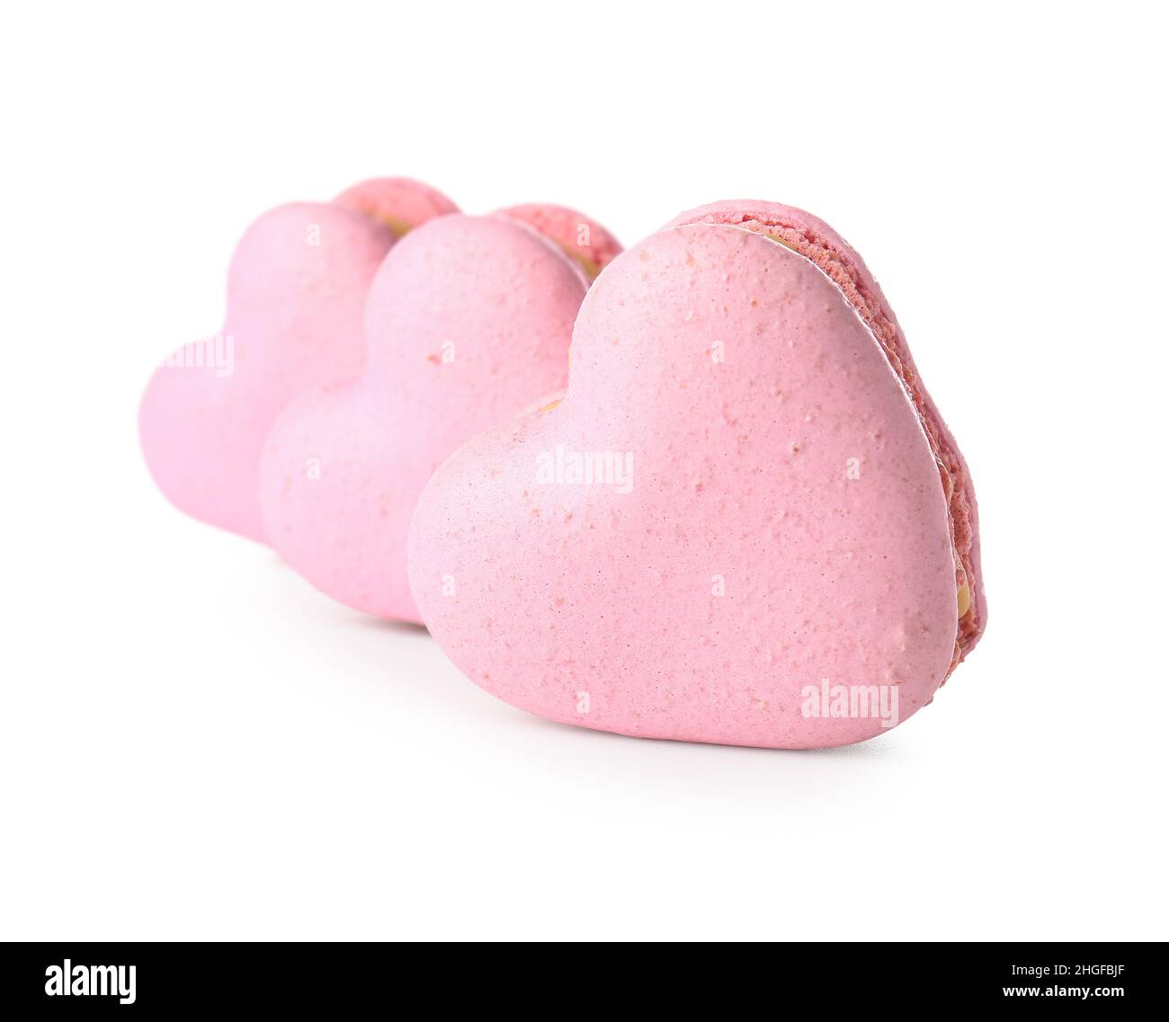 Tasty heart-shaped macaroons on white background Stock Photo - Alamy