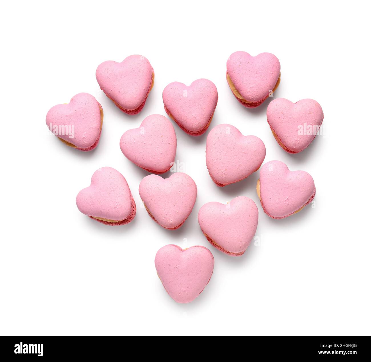 Tasty heart-shaped macaroons on white background Stock Photo - Alamy