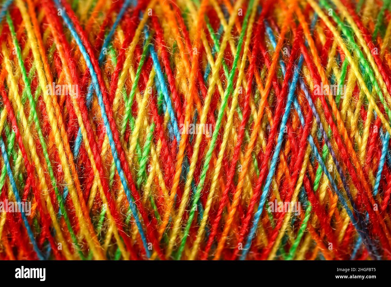 Colorful sewing threads as background Stock Photo - Alamy