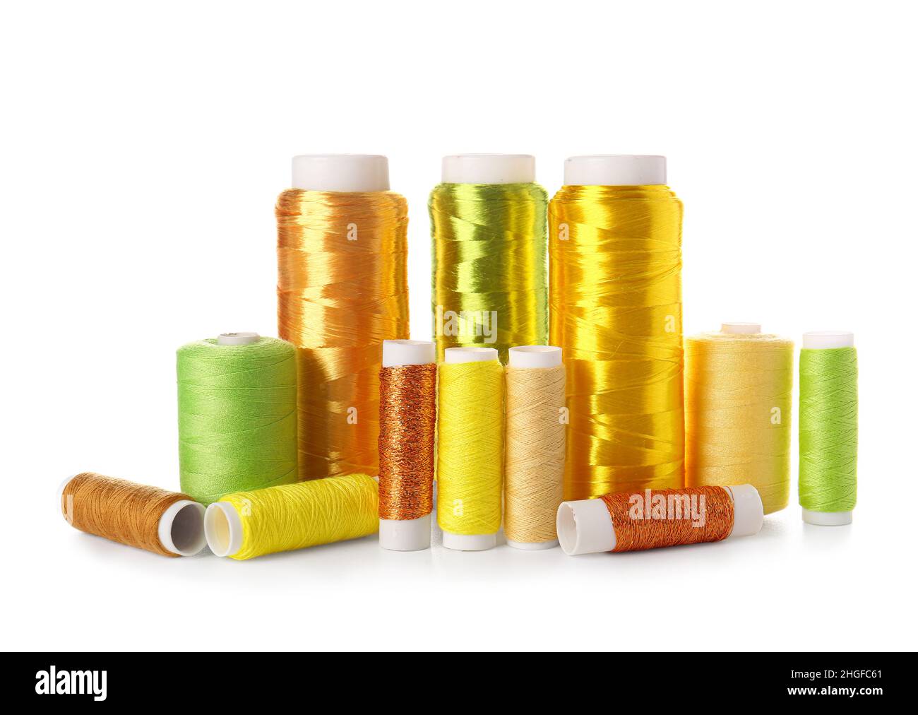 Different sewing thread spools on white background Stock Photo - Alamy