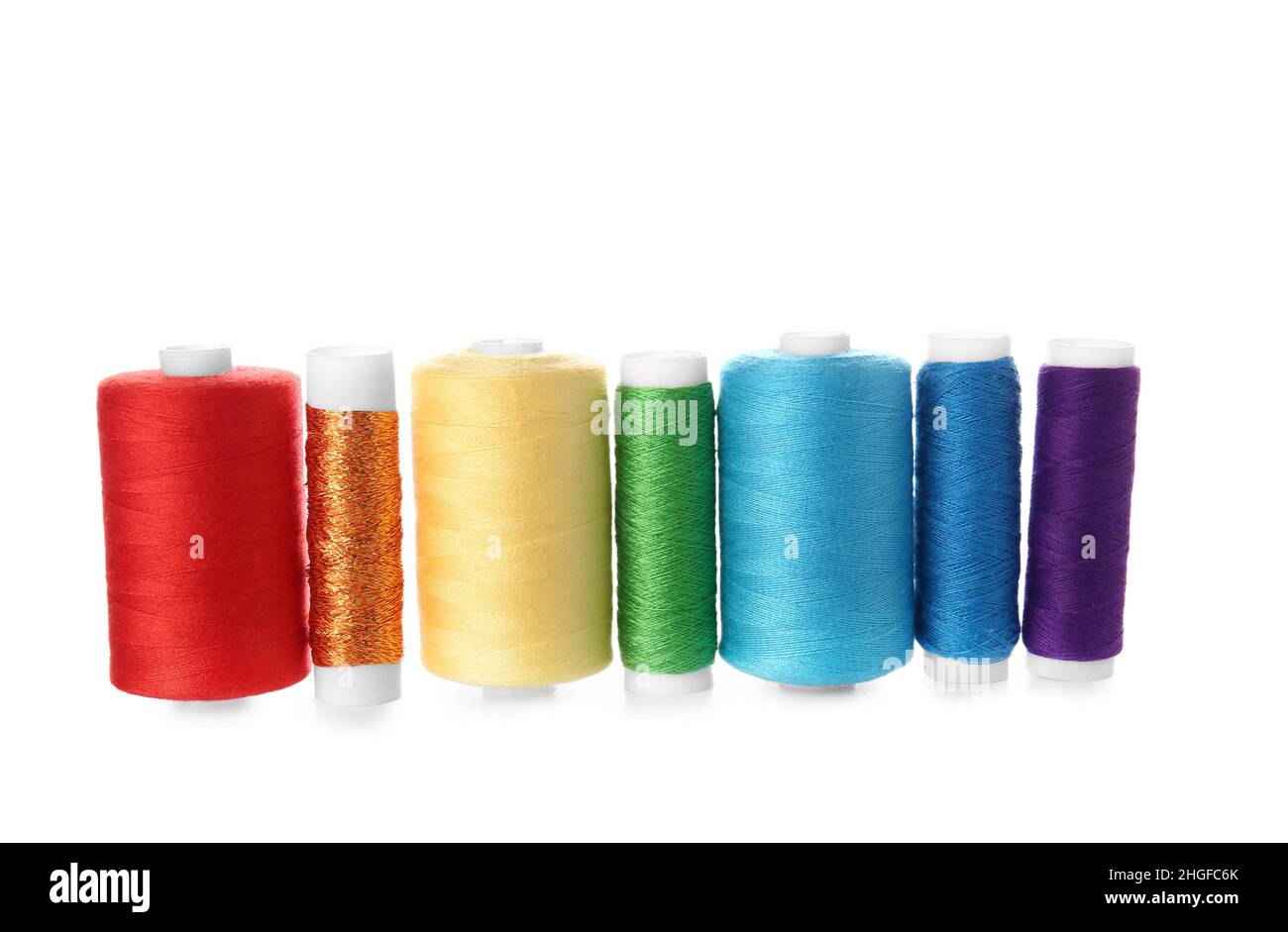 Different sewing thread spools on white background Stock Photo - Alamy