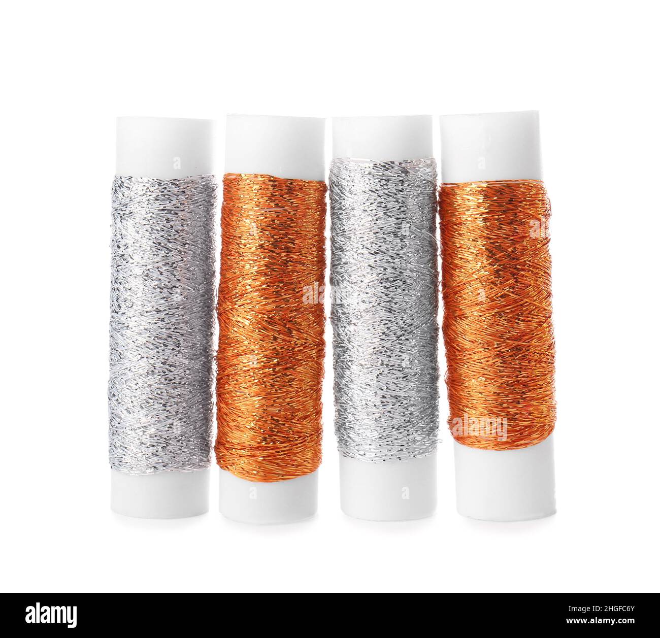 Different sewing thread spools on white background Stock Photo - Alamy