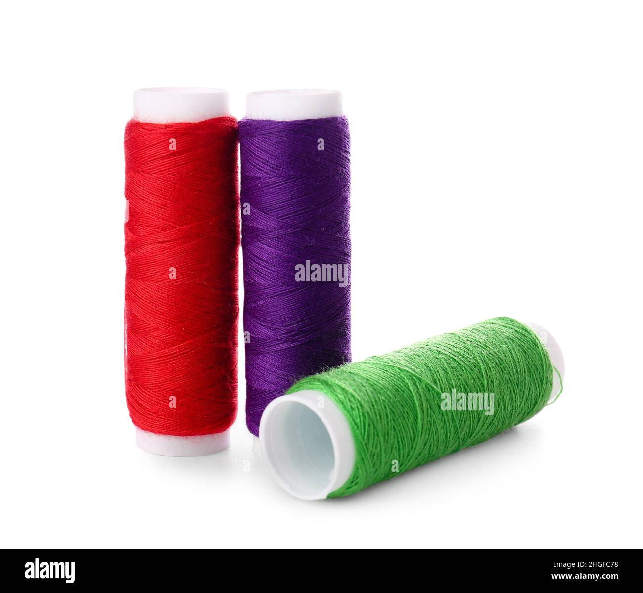Different sewing thread spools on white background Stock Photo - Alamy