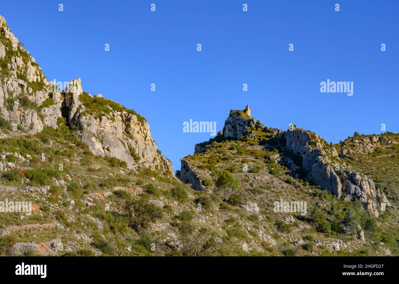 The castle of Tautavel, a ruin overlooking the rugged garrigue ...