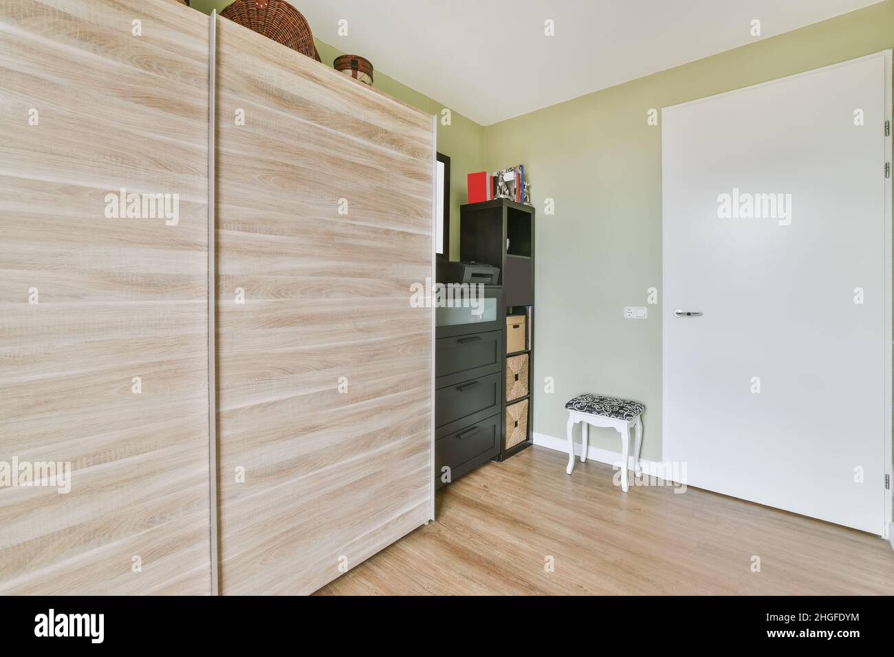 Stylish minimalist workroom with wooden parquet floor Stock Photo - Alamy