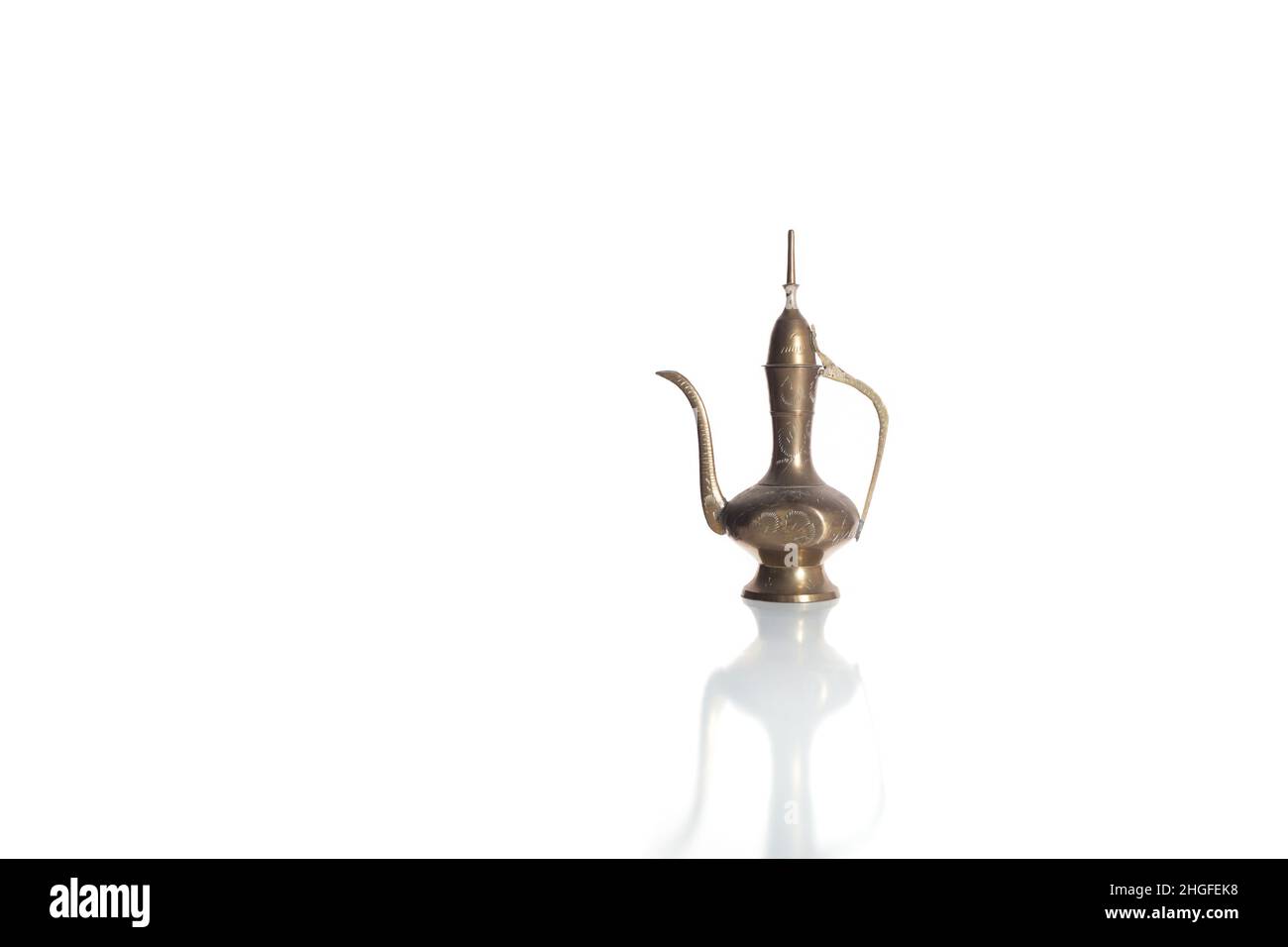 traditional Arabic copper jug on white background, old gold metallic ...