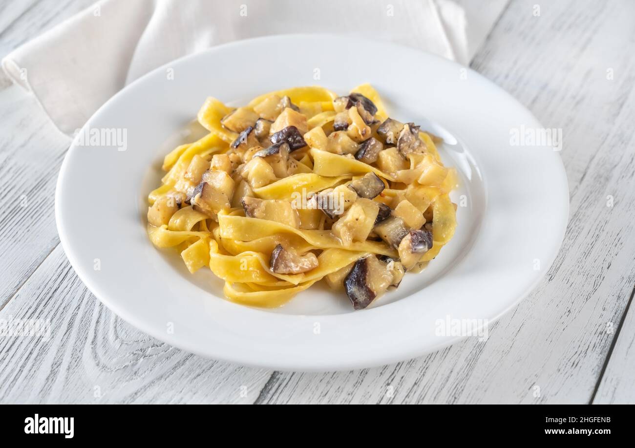 Creamy garlic eggplant and parmesan tagliatelli pasta Stock Photo - Alamy