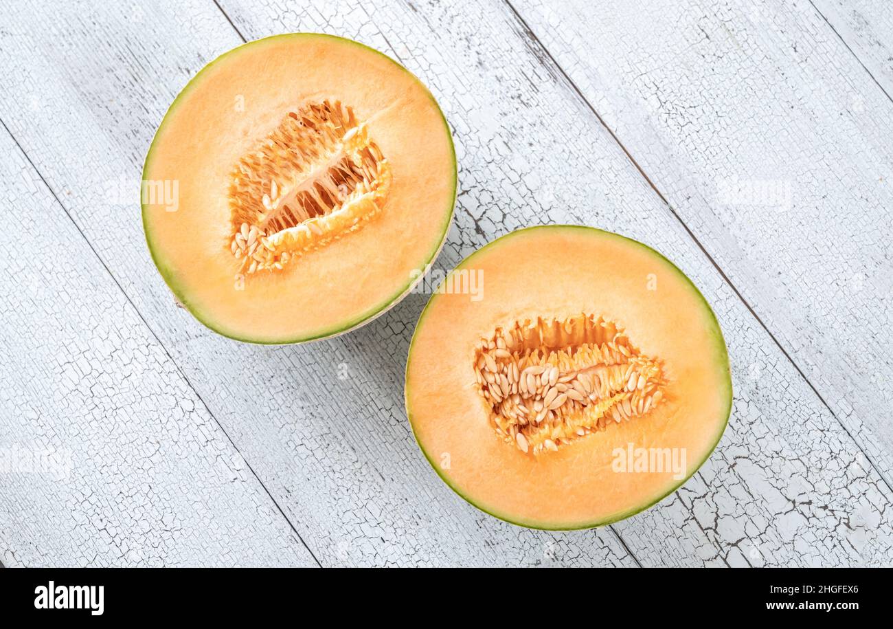 Cross section of Cantaloupe melon flat lay Stock Photo - Alamy