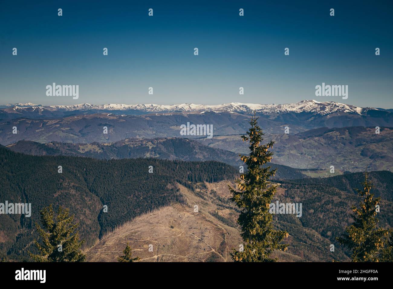 Landscape of snow-capped peaks, late winter early spring Stock Photo ...