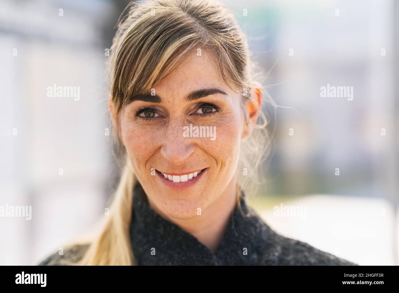 Portrait of happy student woman looking at camera. Successful proud ...