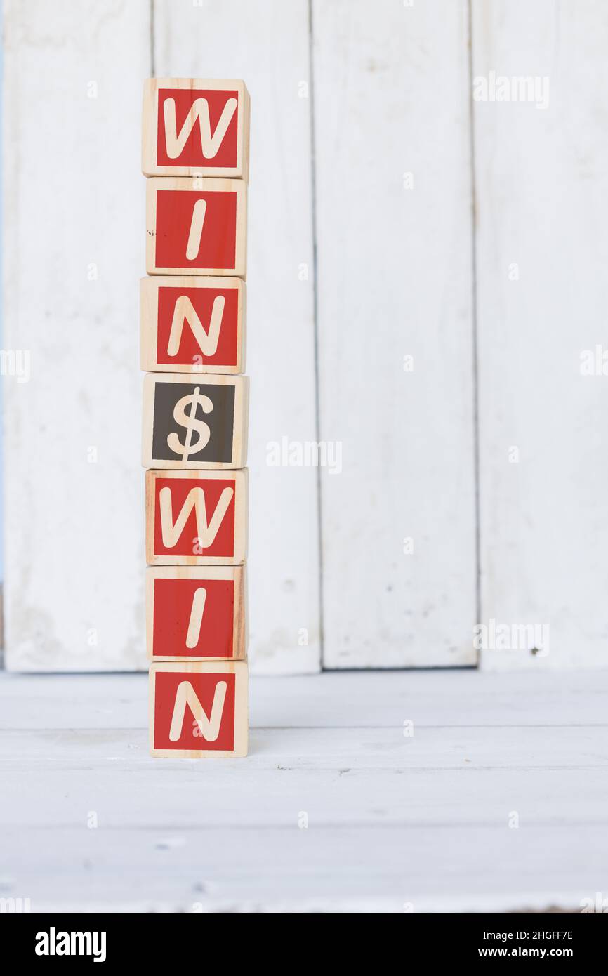 wooden cube, with with word win, on white background Stock Photo - Alamy