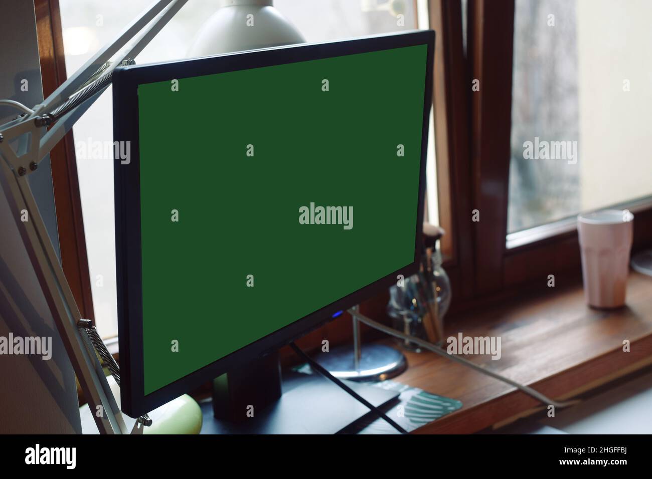 Desktop, computer on the table against the background of a window ...