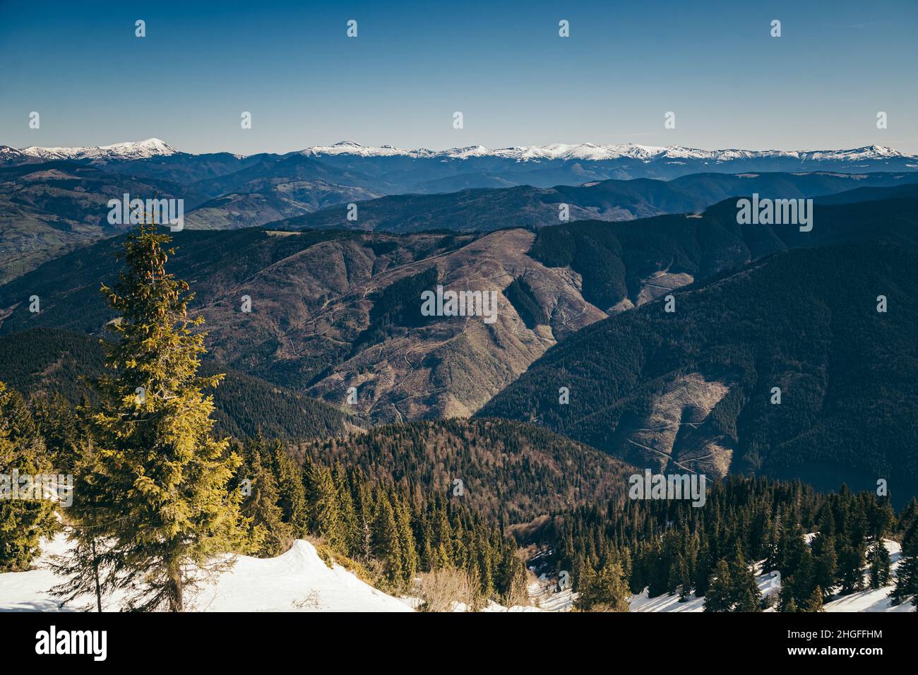 Landscape of snow-capped peaks, late winter early spring Stock Photo ...