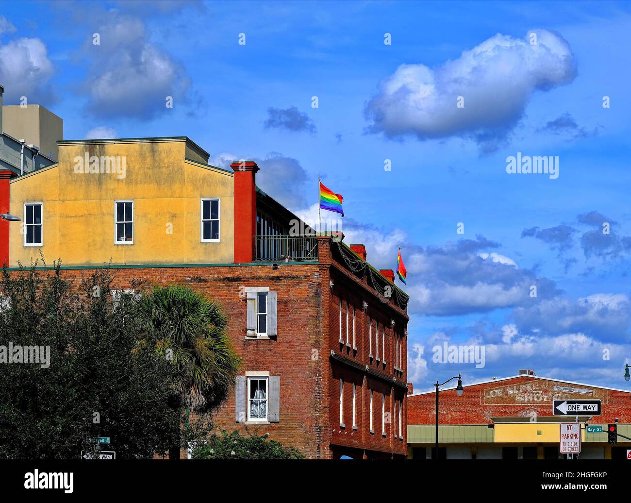 Gay Pride Flags on Old Brick Building Stock Photo - Alamy