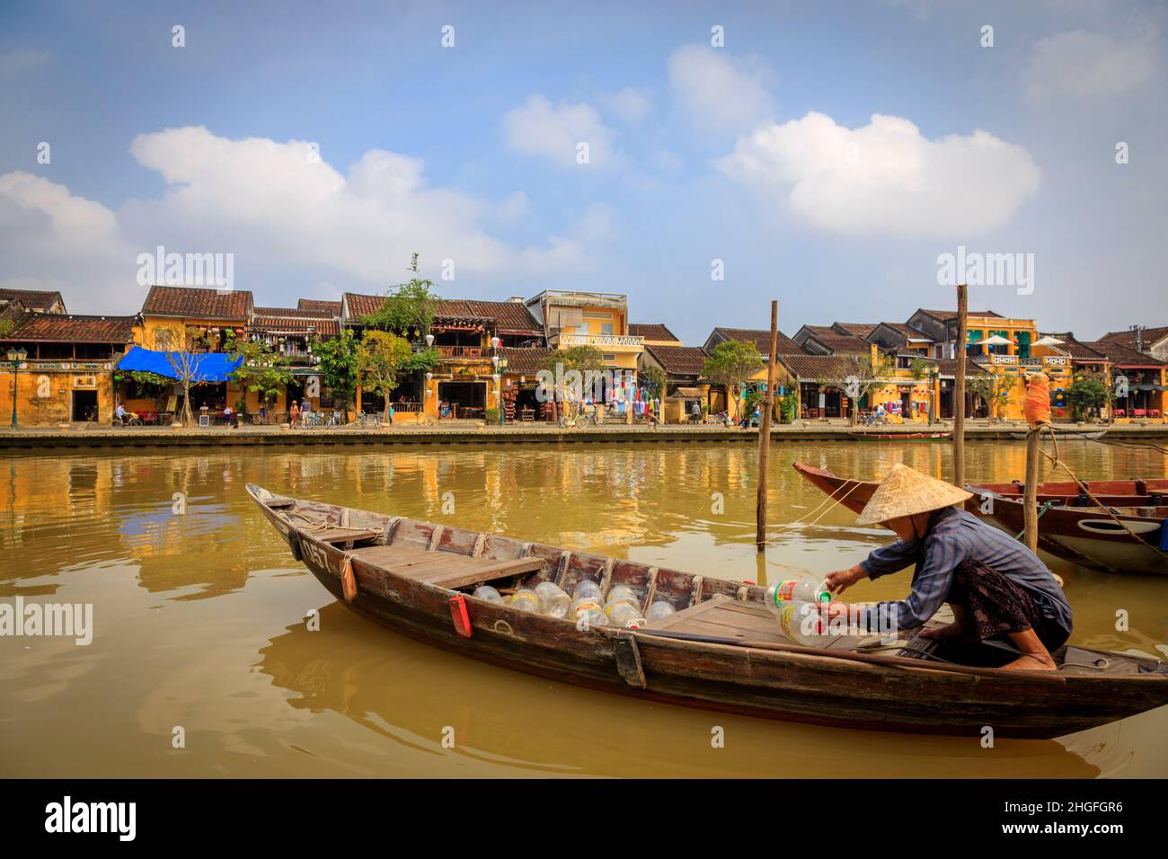 A tour operator gets a wooden row boat ready for a tour Stock Photo - Alamy