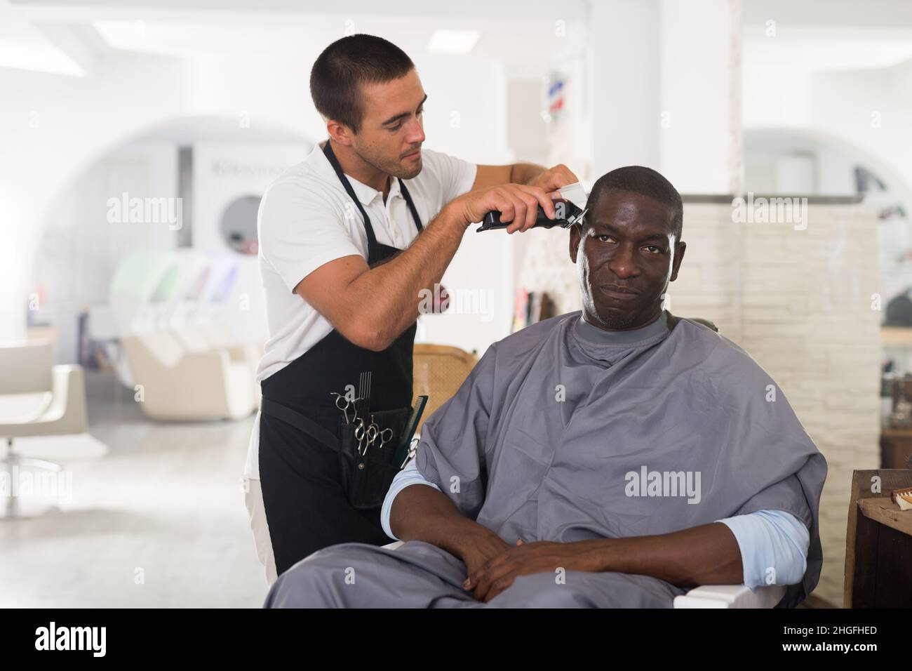 African american barber cutting hair hi-res stock photography and ...