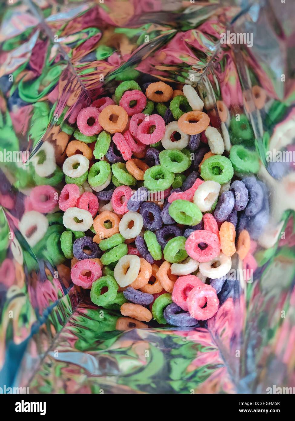 Colorful fruit sugary corn cereal rings. close up shot of this ...